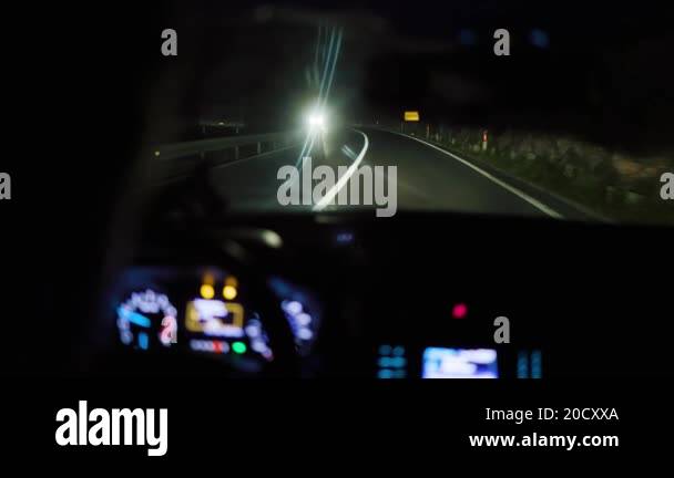 Slow motion view from car moving in city with blurred night lights ...