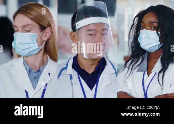 Close up mixed-races doctors look at camera with medical mask in ...