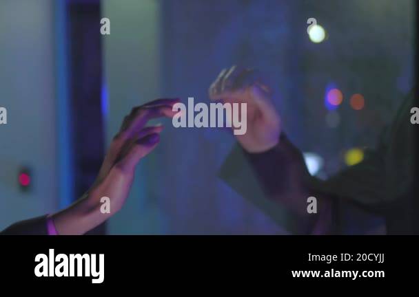 Close up hands businessman touch finger woman through the window glass ...