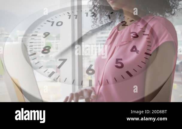 Clock animation over woman standing by window in office. Time, business ...