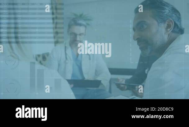 Discussing patient data, medical professionals with charts and graphs ...