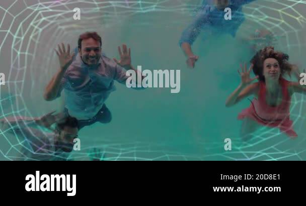 People swimming underwater with geometric grid animation over scene ...