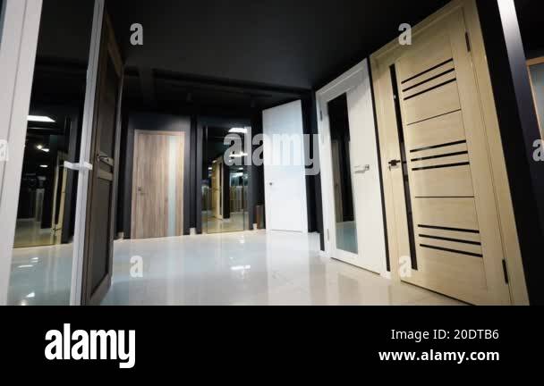 A modern exhibition showcasing a range of doors, including wooden ...