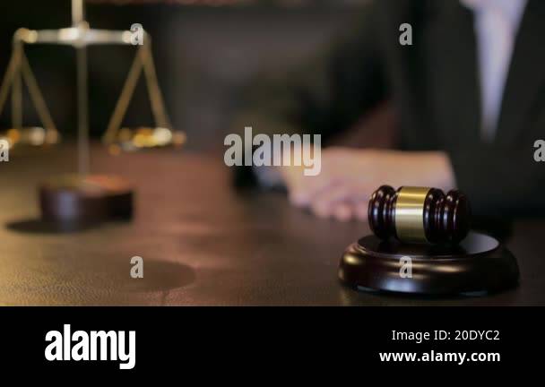 Hand of Young Female Judge Hitting the Gavel Hammer in Court Stock ...