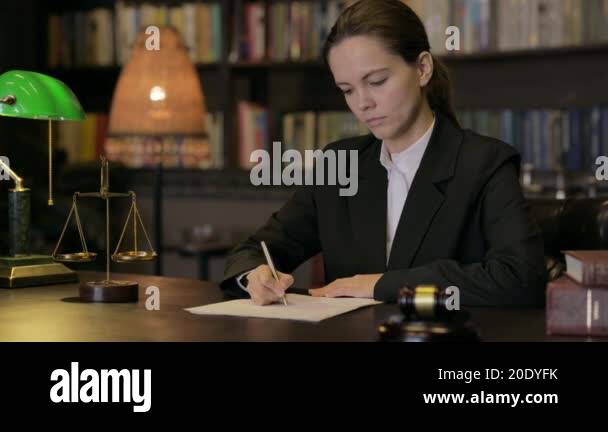 Young Female Judge Writing an Order in Courtroom Stock Video Footage ...