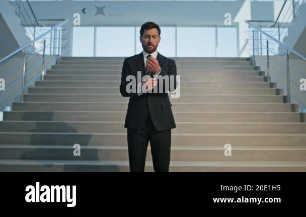 Stylish manager crossing hands standing on office staircase closeup ...