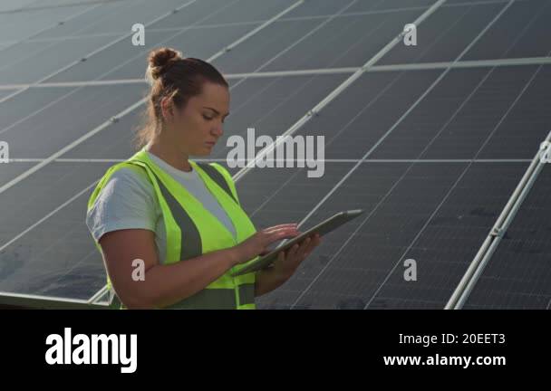 Woman Engineer Configuring Solar Panels Using Smartphone After Setup ...