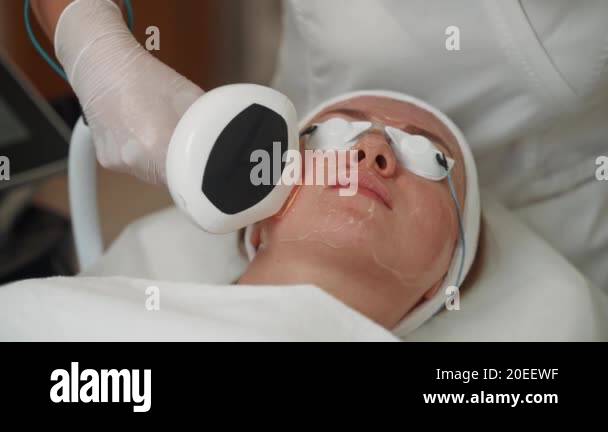 Cosmetologist Performing Lumecca Skin Treatment for Pigmentation Vascular Effects and Wrinkle ...