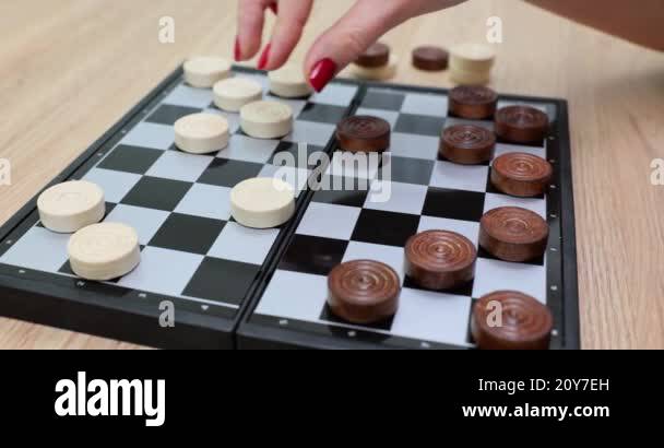 Strategic game of checkers in a competitive match between two players ...