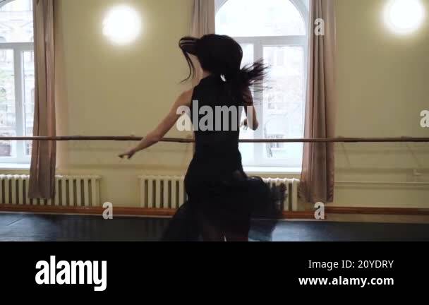 The prima ballerina performs circular movements in the centre of the ...