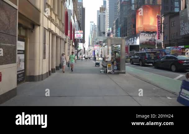 New York City, New York, USA - 08.01.2024: People walk along a vibrant ...
