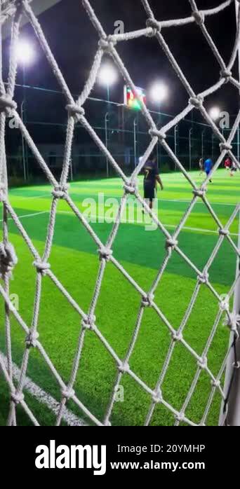 Soccer players on the green field at night. Fun match Stock Video ...