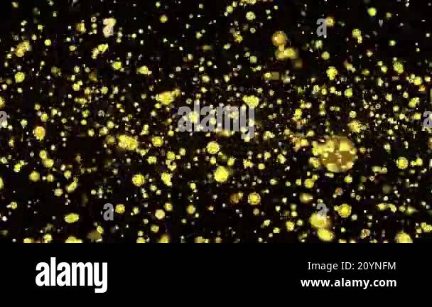 Flying Colored Particles in 4K on black background. Dust light shine ...