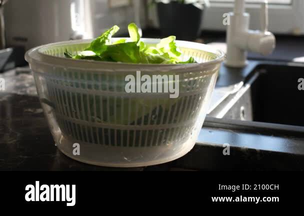 A man dries salad greens after washing Stock Video Footage - Alamy