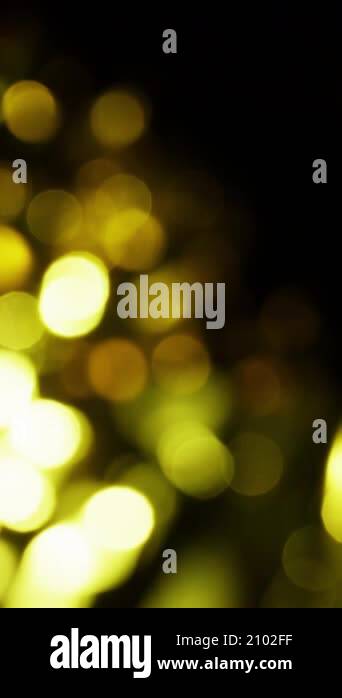 Floating yellow light orbs shimmering and gradually fading through ...