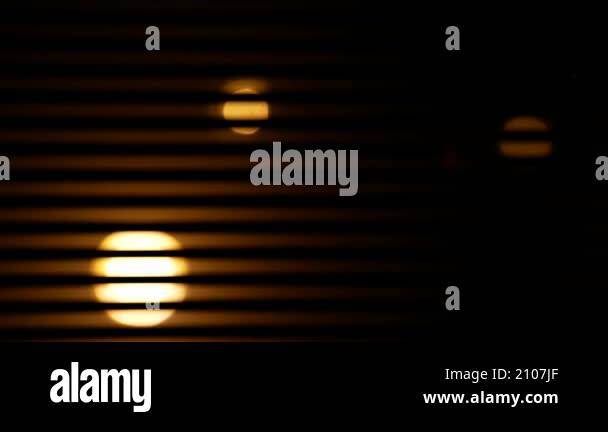 Flickering lights with visible shutter effects create streaks and ...