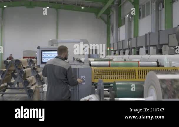 ALMATY, KAZAKHSTAN - OCTOBER 08 2024: Factory worker operates and ...