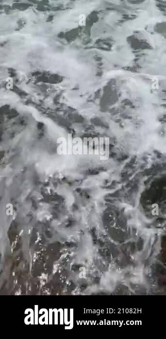 Ocean tides swirling in a rock pool on the beach Stock Video Footage ...