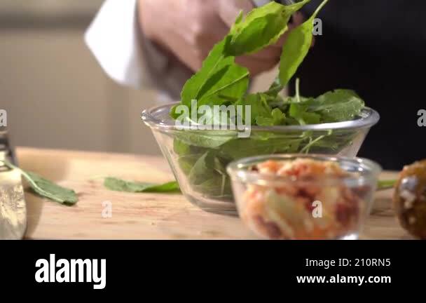 With the action of scissors snipping through crisp green vegetables ...