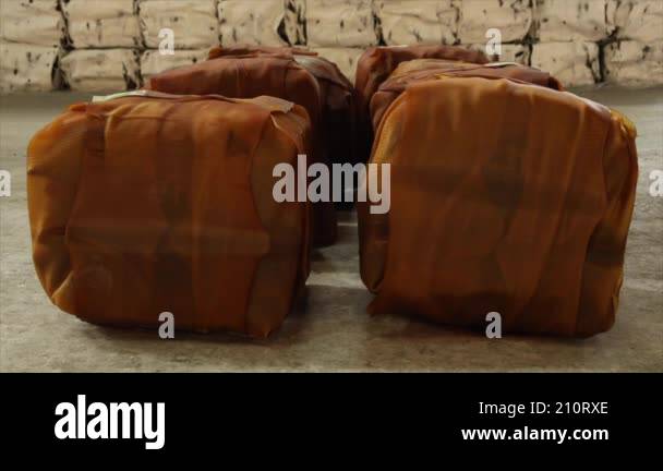 Raw rubber sheet products packed into a cube shape in the warehouse ...