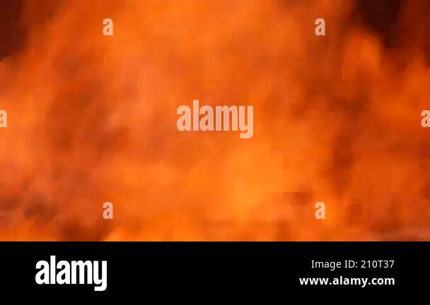 the fire blazes on, casting a mesmerizing glow and radiating intense ...