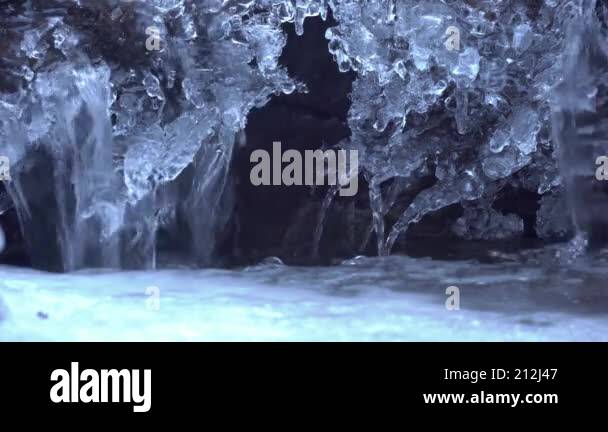Ice melting in spring at frozen river, water flooding in spring, Close ...