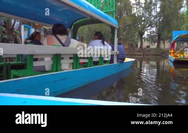 Colorful Boats in Xochimilco Doing Tours by. canals with floating ...