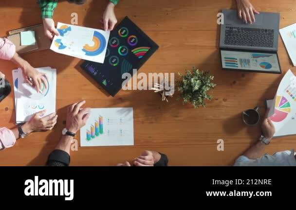 Top down view of business woman explain and present financial chart ...