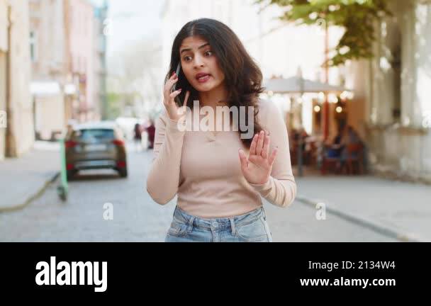Angry mad stressed Indian young woman arguing while talking on ...