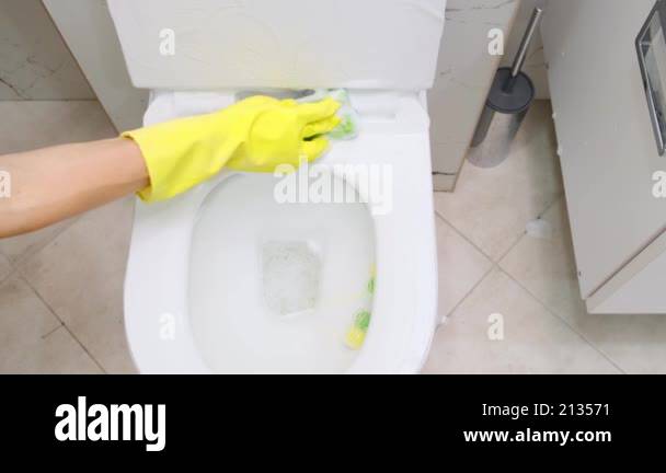 top View slow motion cleaning toilet seat restroom at house sponge ...