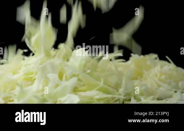 Spinning and falling shredded white cabbage slow motion Stock Video ...