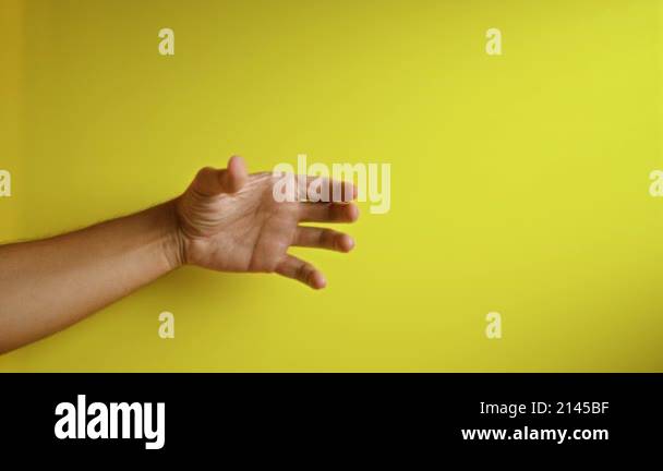 Hand fingers gesturing male arm on yellow background illustrating ...