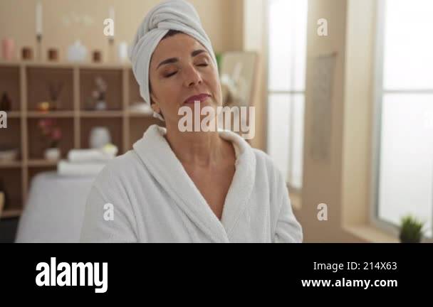 Elderly woman enjoying serene spa moments in an indoor beauty center ...