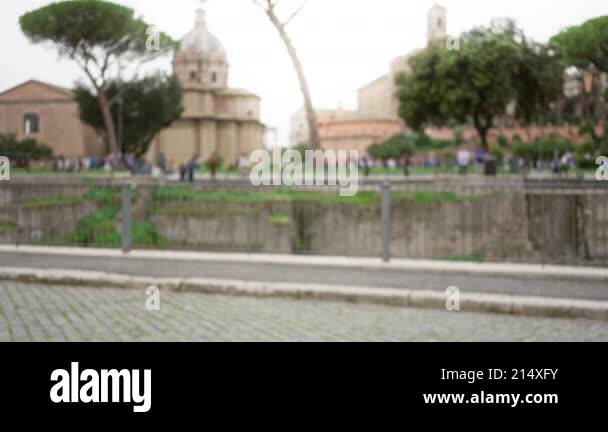 Blurry, defocused scene of people at the historic roman forum in rome ...