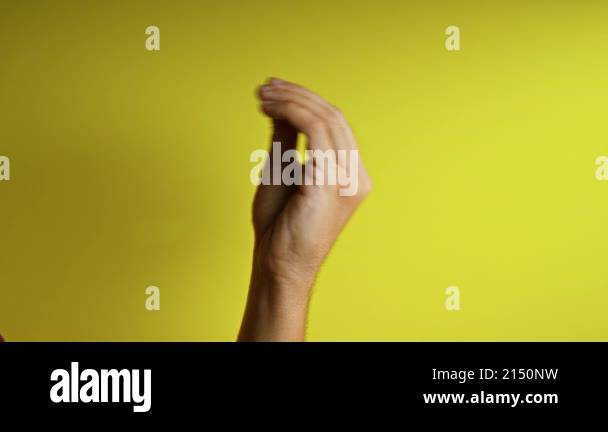 Human hand performing a traditional italian gesture against a vibrant ...