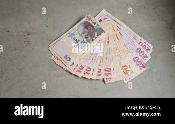 Turkish banknotes, including 5, 10, 50, and 200 lira denominations, are ...