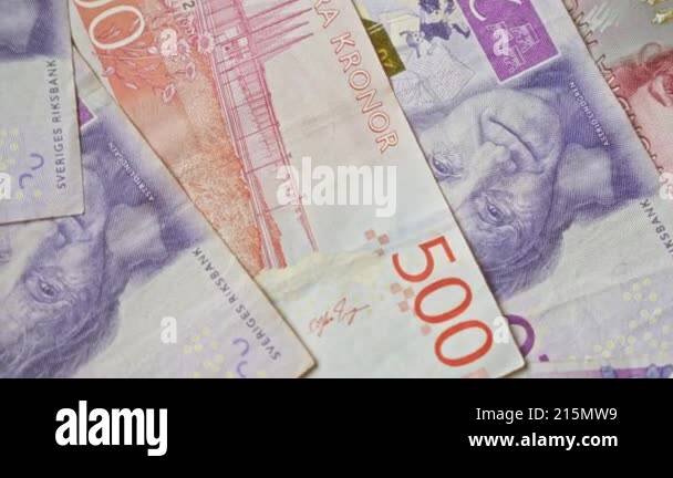 Swedish krona banknotes of various denominations spread out, showcasing ...