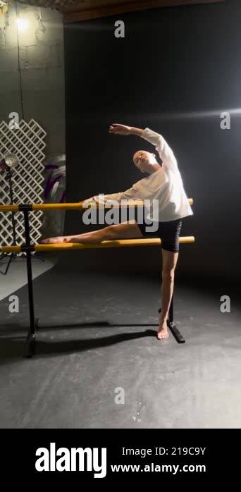 A girl showcases her ballet skills in a studio, blending dance and ...