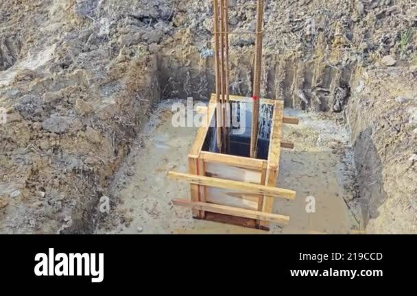 Groundwork of cement concrete with metal reinforced frame or block on ...