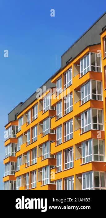 Block of flats with large balconies. Facade of a new high rise building ...