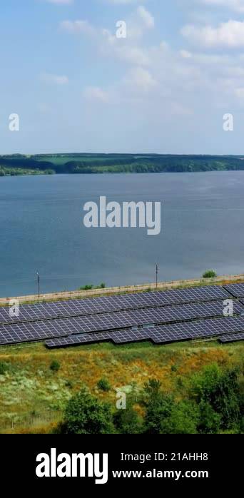 Solar panels on nature background. Blue sunny batteries on field near ...