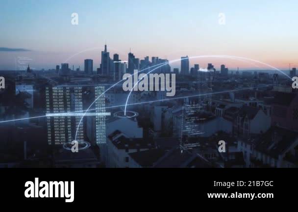 Digital lines connecting buildings in the Frankfurt skyline at sunset ...