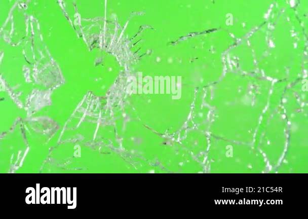 Super slow motion of gunshot through the glass, shattering against ...