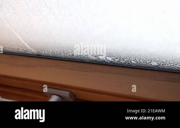 Close up of condensation on the window in a house in cold season, water ...