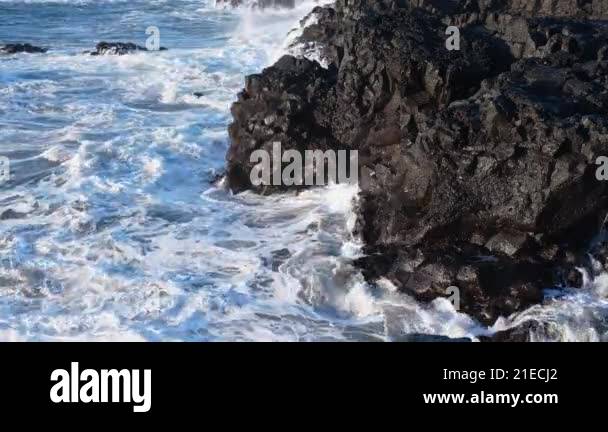 Extreme huge waves crash on the shore, Rocky ocean coast in Iceland ...