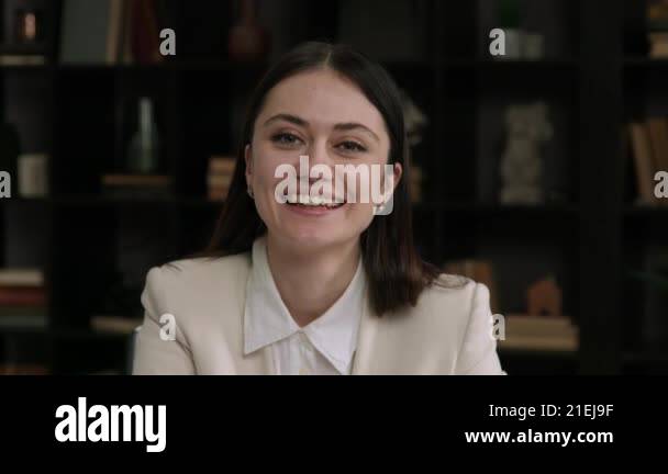 Smiling woman manager enjoys work in modern office. Young female ...