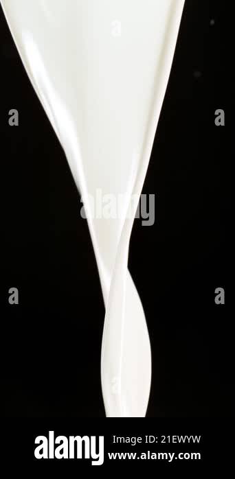 Super slow motion of flying milk splashes. Filmed on high speed cinema ...