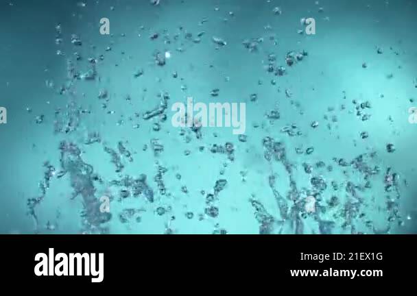 Super Slow Motion of Flying Water Splashes, Isolated on Blue Background ...