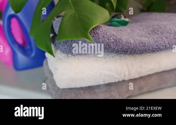Washing powder capsules fall onto a towel, three-in-one washing ...