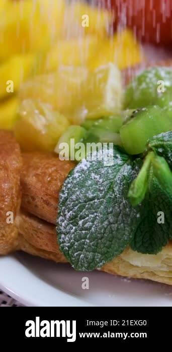 Mango grapes mint sprinkle with powdered sugar cake. High quality 4k ...